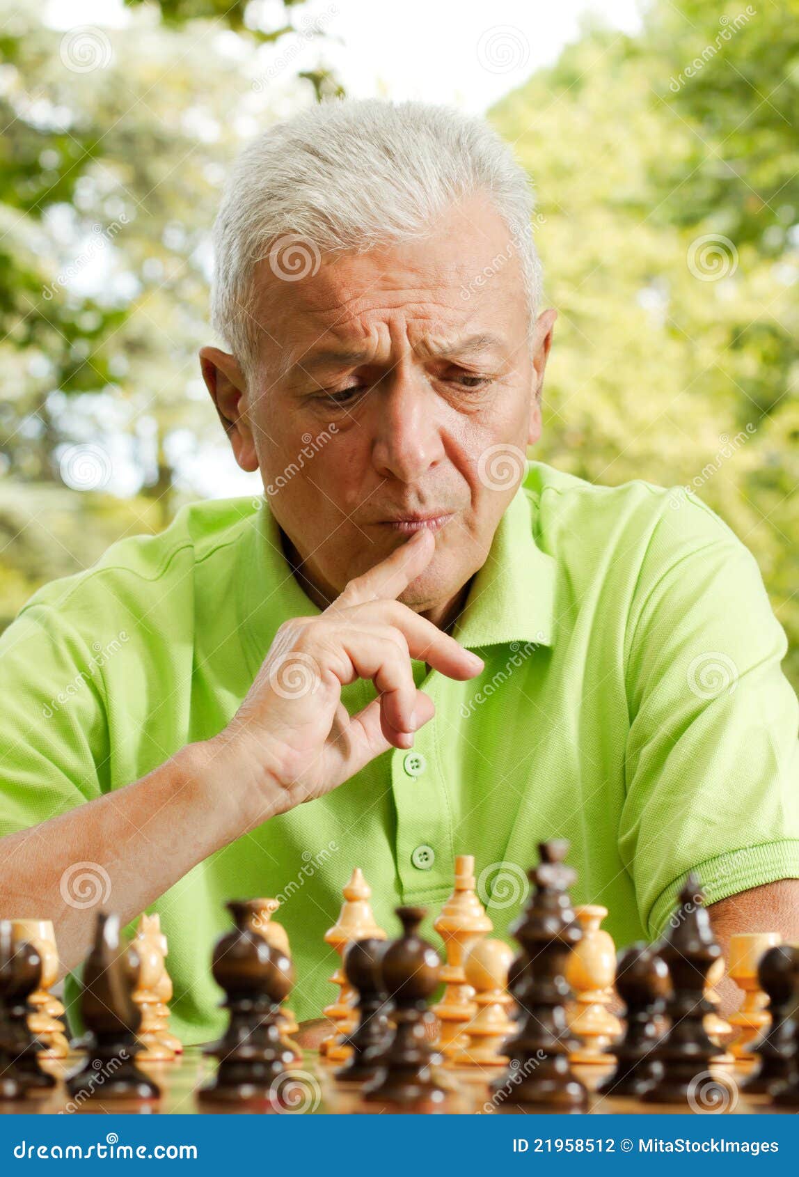Worried Elderly Man Playing Chess Outdoors Stock Photo - Image of ...
