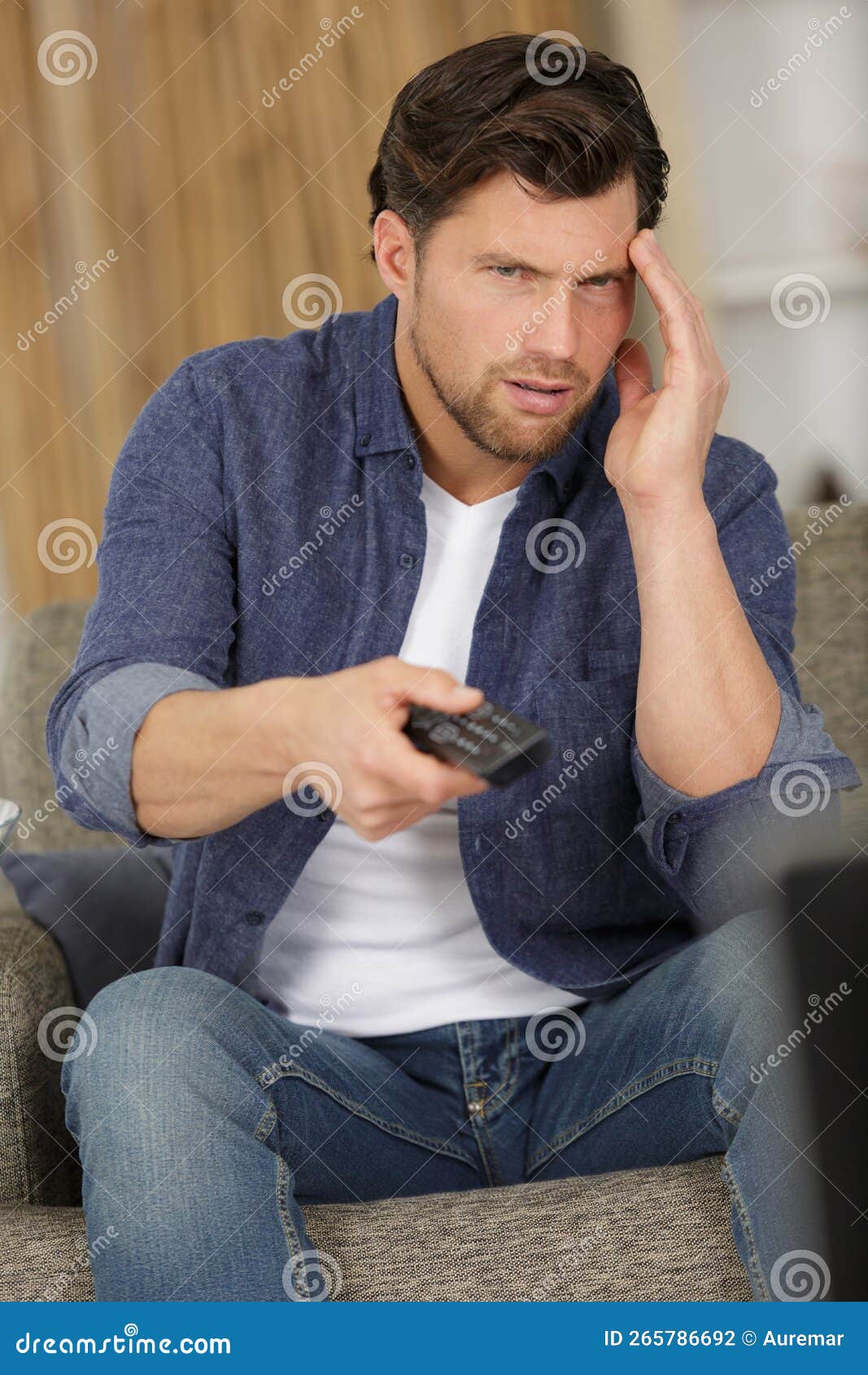 Worried Guy with Remote Control Stock Photo - Image of supporter ...
