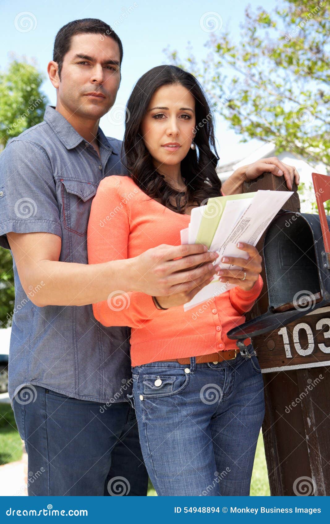 Worried Hispanic Couple Checking Mailbox Stock Photo - Image of couple, post: 54948894