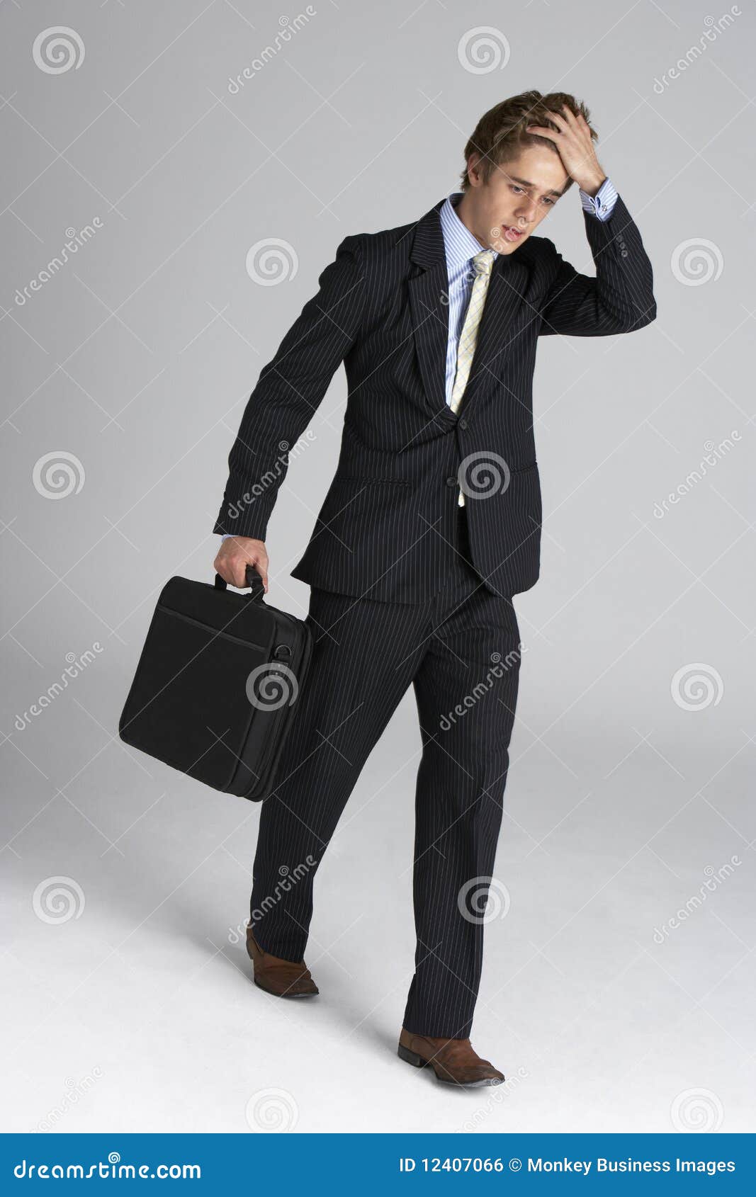 Worried Looking Executive with Briefcase Stock Photo - Image of ...