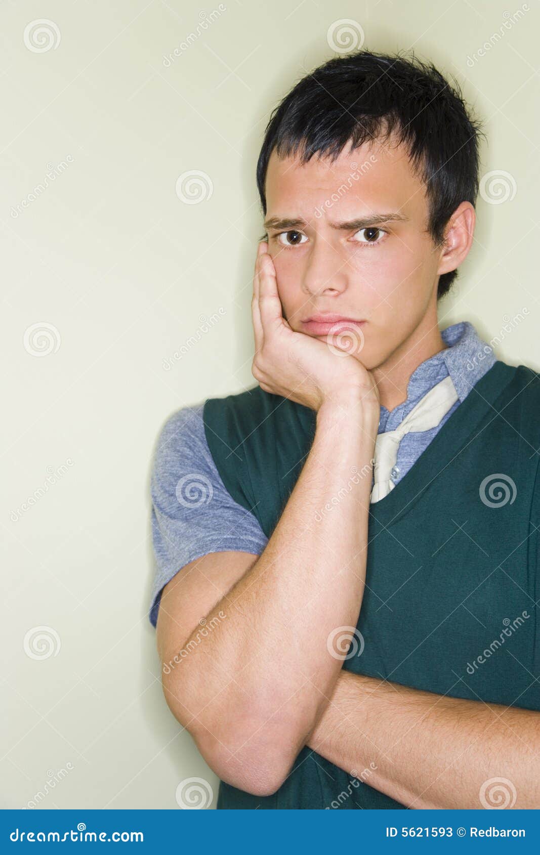 Worried looking young man stock image. Image of leaning - 5621593