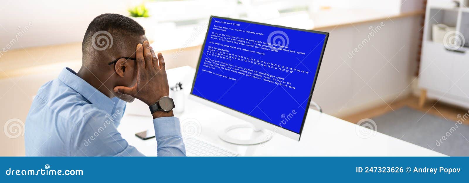 Worried Man at Computer with System Failure on the Screen Stock Photo ...