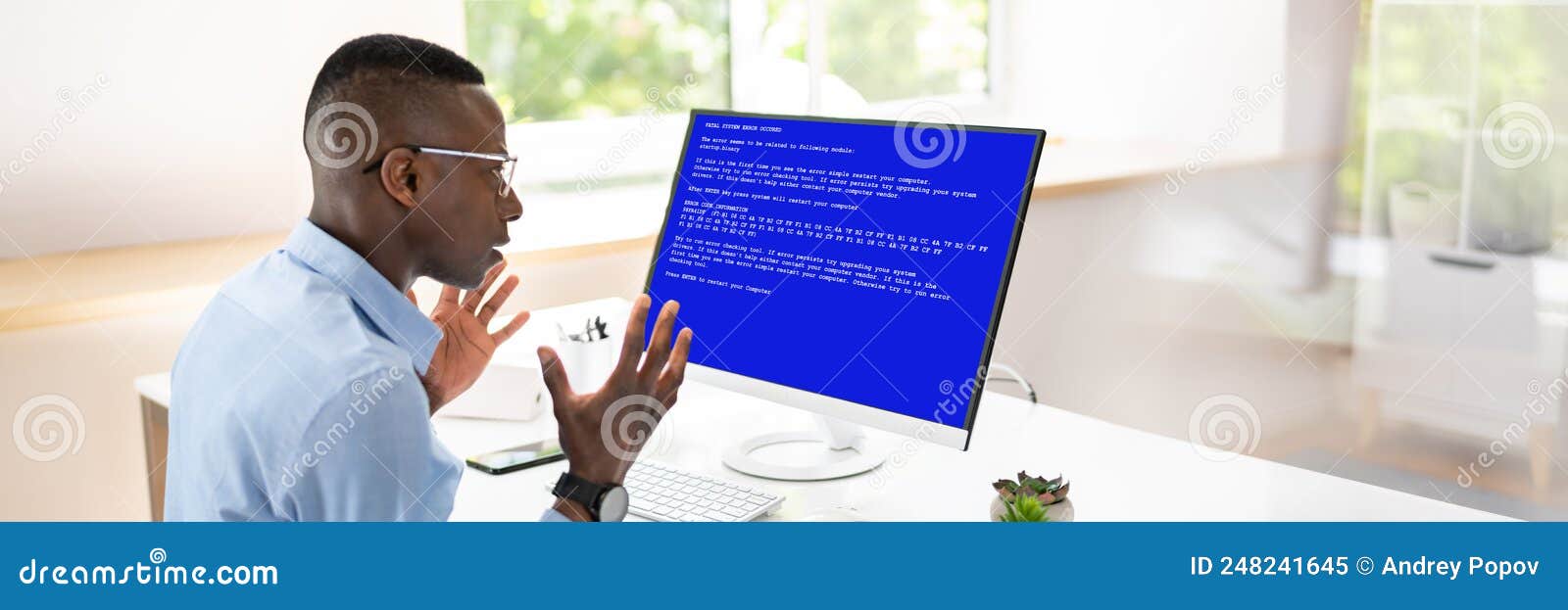 Worried Man at Computer with System Failure on the Screen Stock Image ...