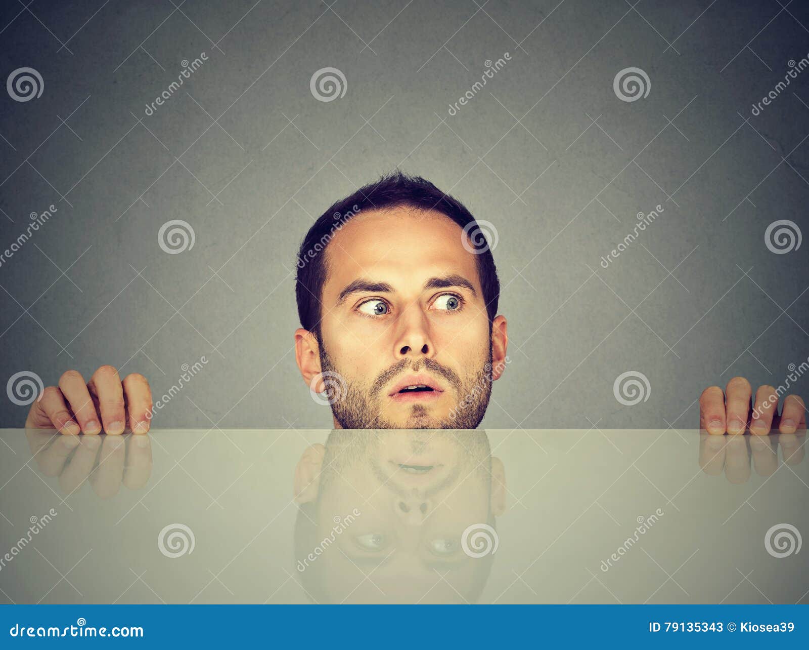 Worried Man Peeking from Under the Table Stock Image - Image of afraid ...