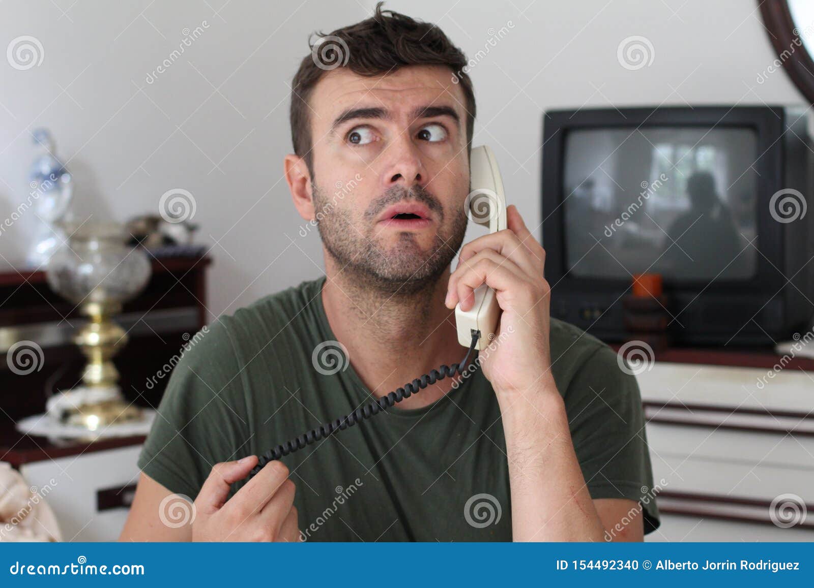 Worried man on the phone stock photo. Image of customer - 154492340