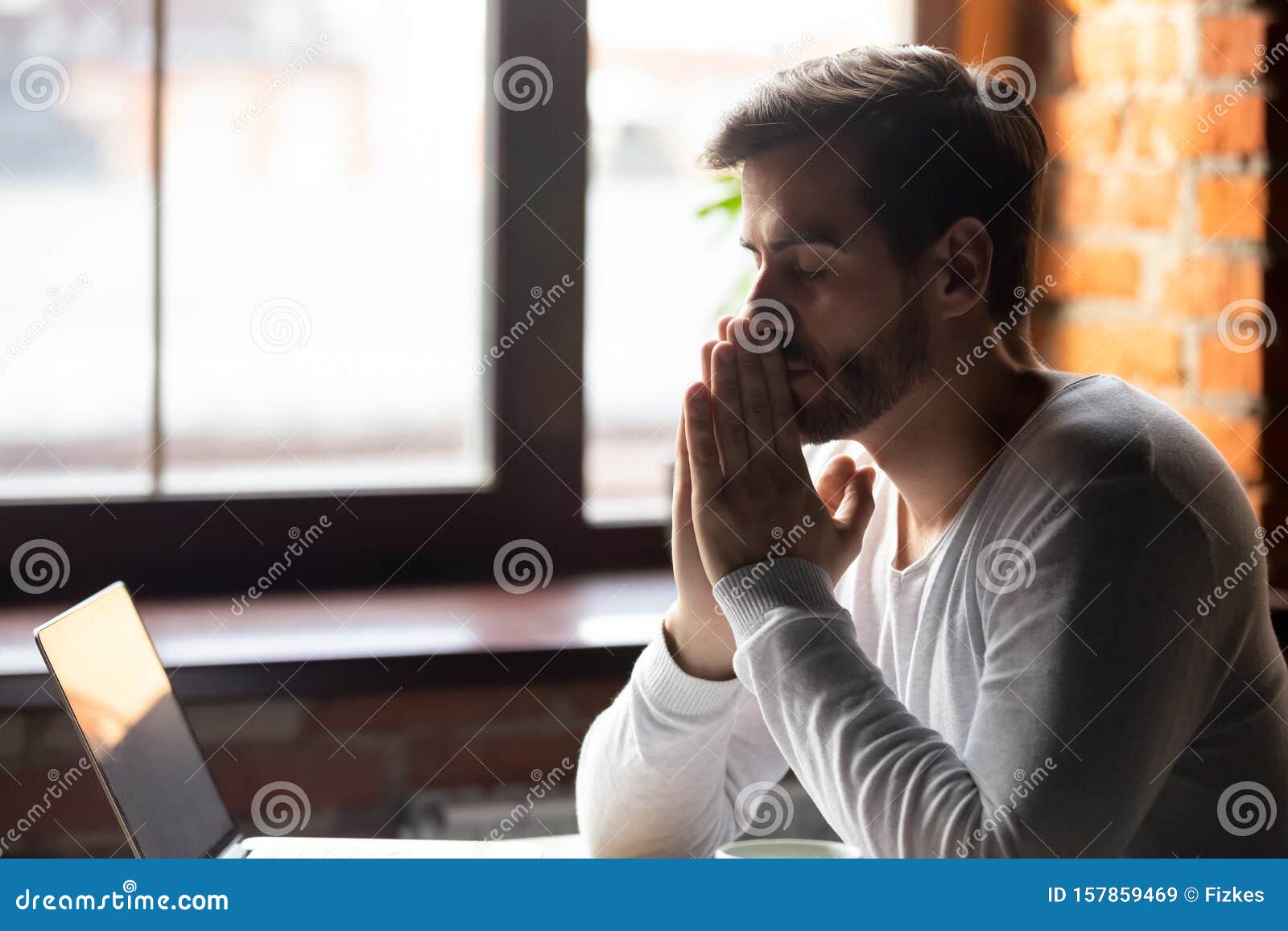 Worried Man Thinking about Problem Puts Hands Together in Prayer Stock ...