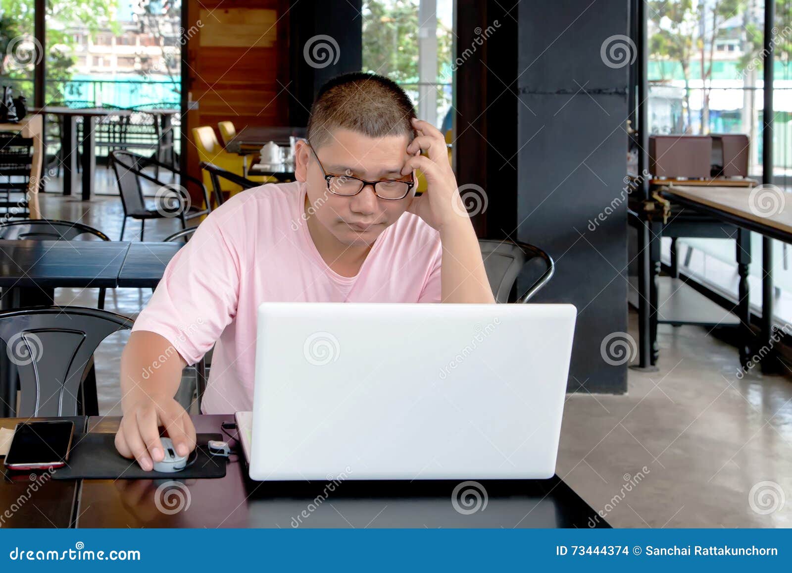 Worried Man Using a Laptop Computer and Looking at the Screen., Stock ...