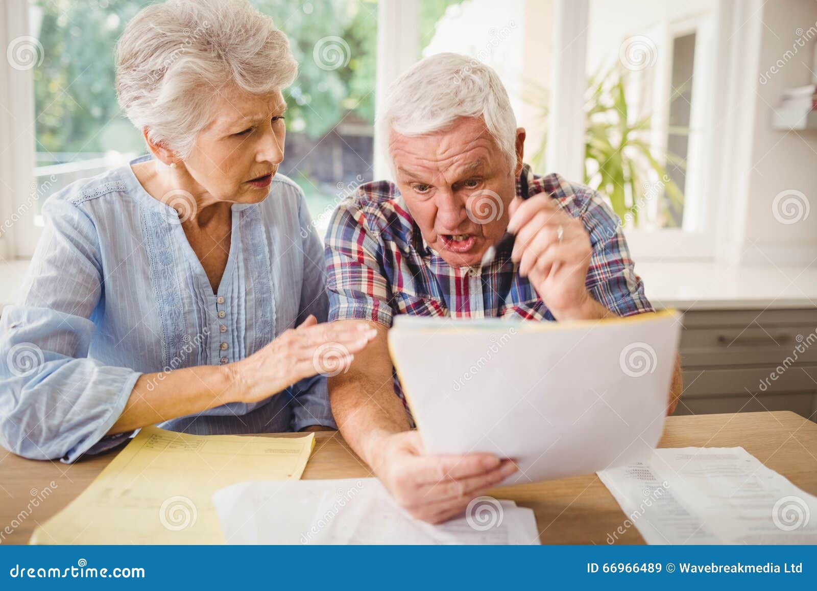 Worried Senior Couple Checking Their Bills Stock Image - Image of ...