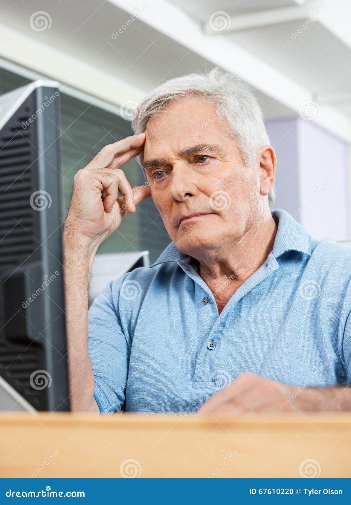 Worried Senior Student Looking at Computer in Class Stock Photo - Image ...
