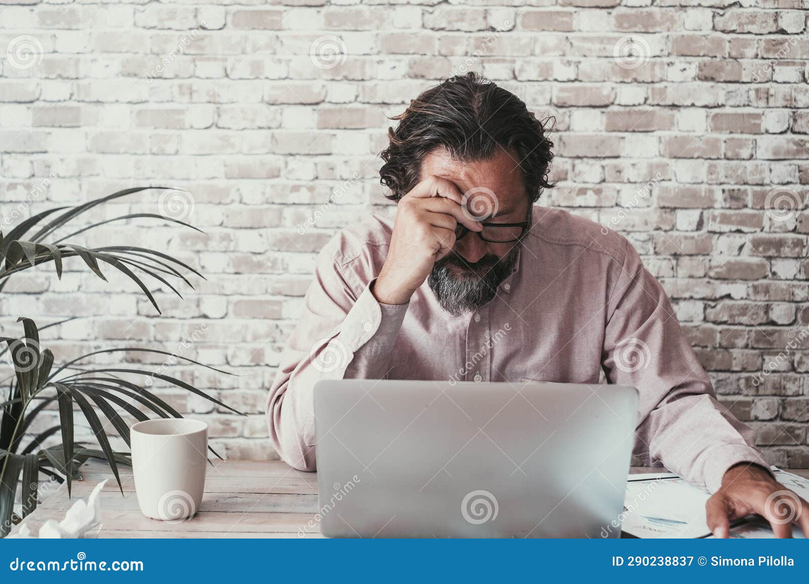 Worried Worker Man Touching His Front with Thoughts Sitting in Front of ...