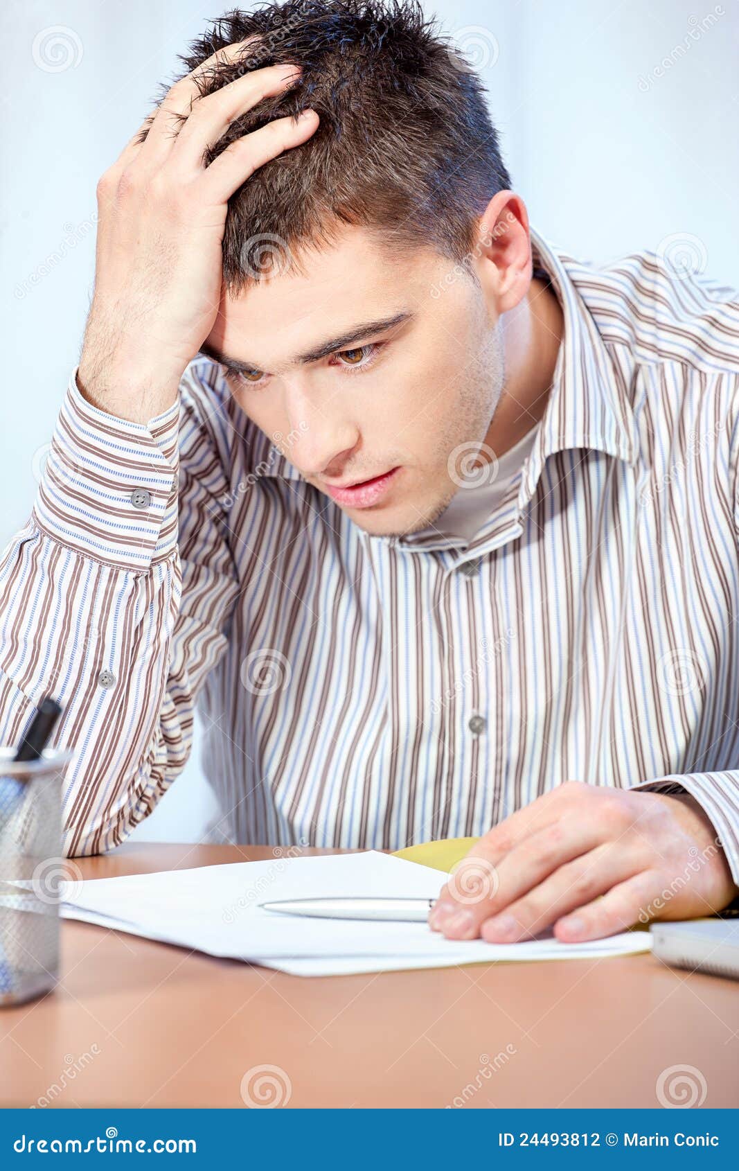 Worried young business man stock photo. Image of tedium - 24493812