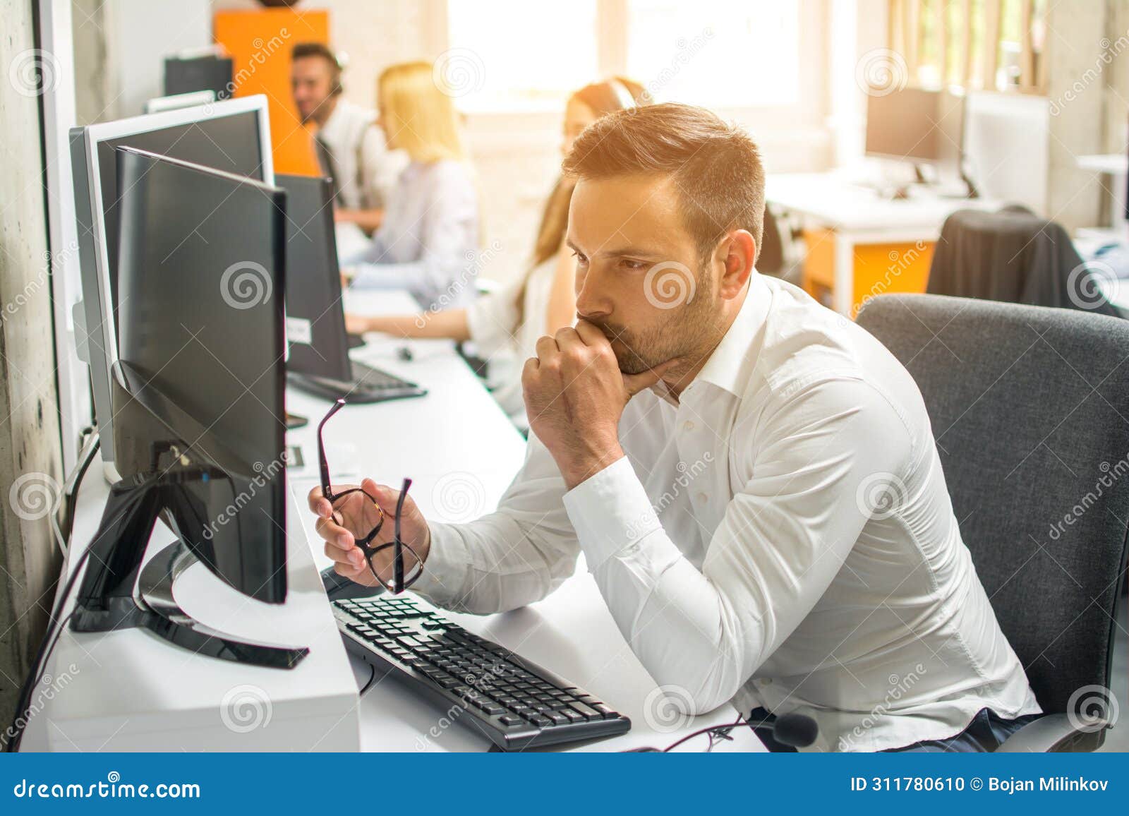Worried Young Business Man Working on Computer at Office. Stock Photo ...