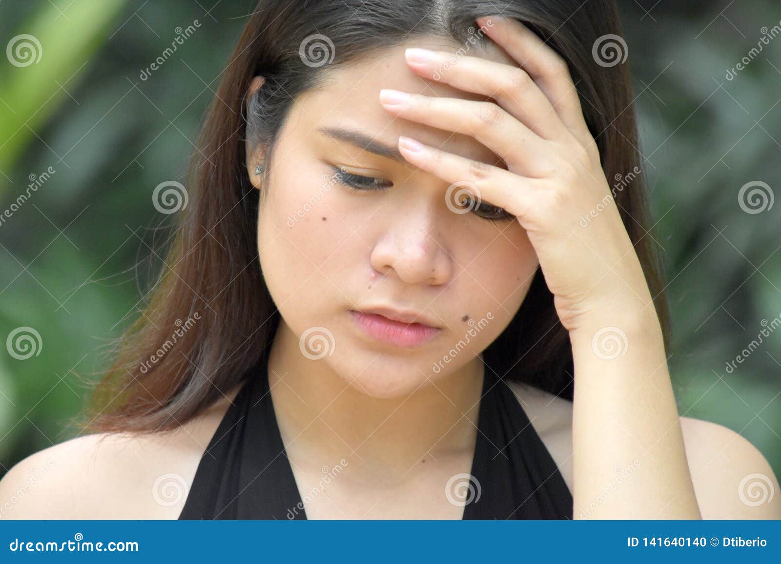 A Worrisome Filipina Female Stock Photo - Image of worrisome, filipina ...