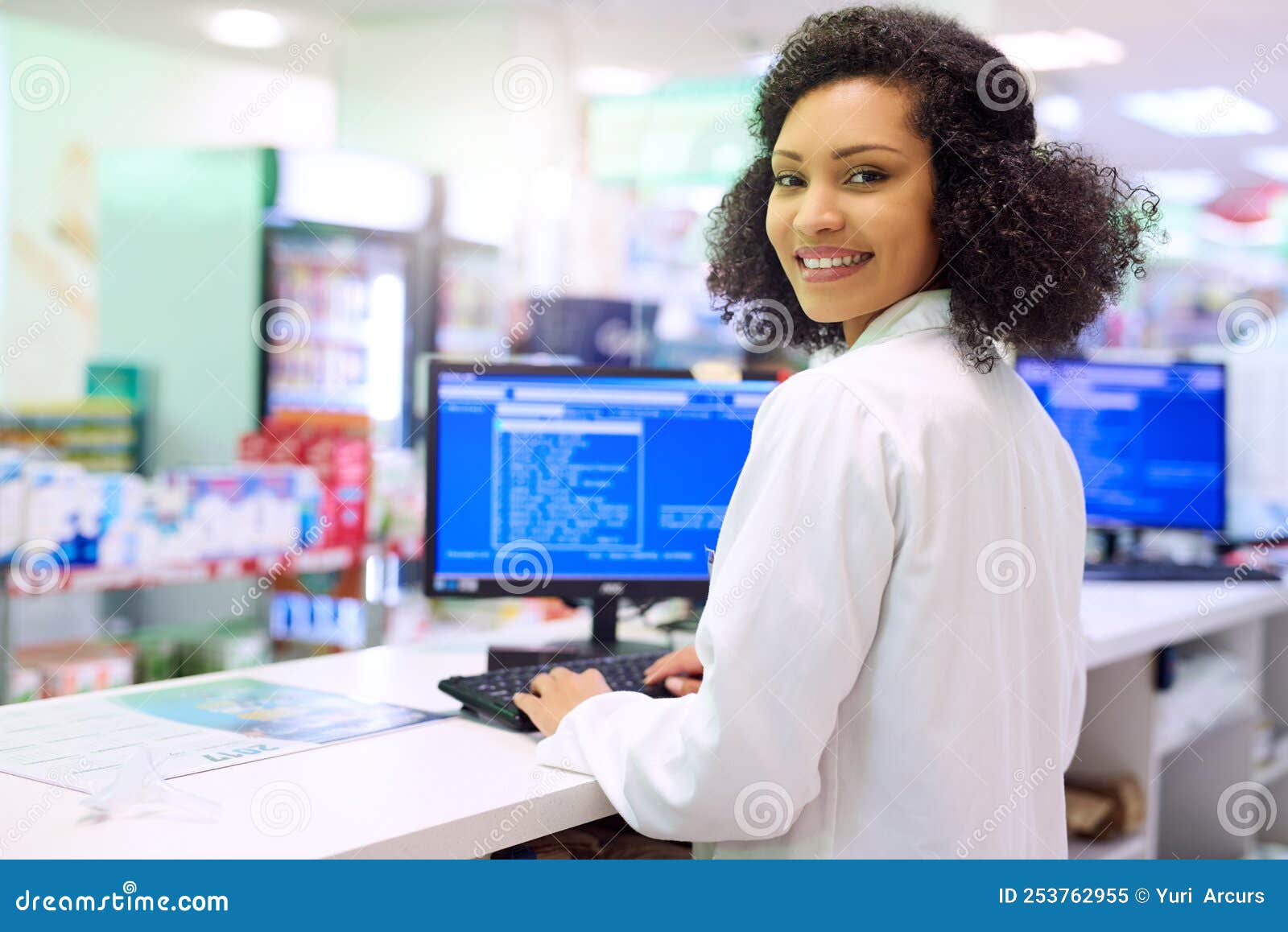 Would You Like a Receipt. a Pharmacist Working on a Computer in a ...