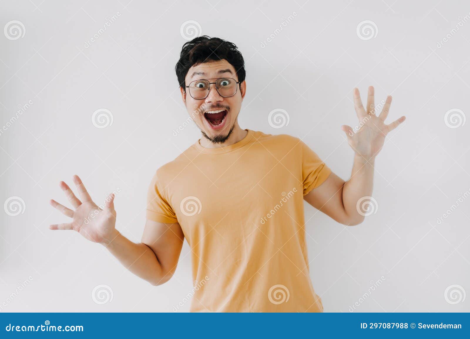 Wow And Happy Surprised Face Of Asian Man In Yellow T Shirt Isolated On