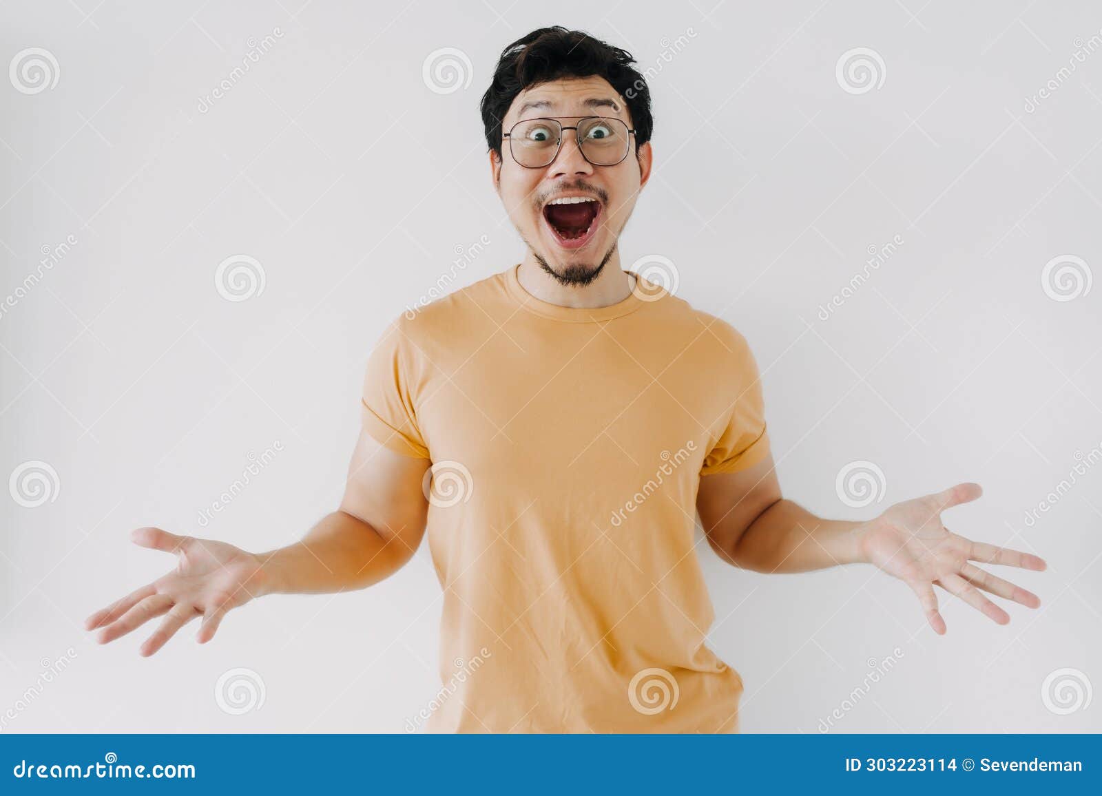 Wow And Happy Surprised Face Of Asian Man In Yellow T Shirt Isolated On