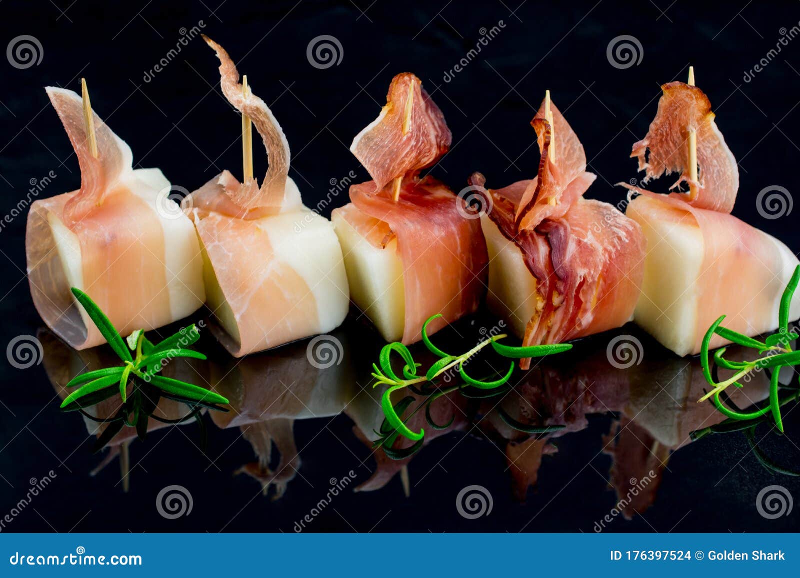 Wrap a Slice of Parma Ham Around Each Piece of Melon.Â Stock Photo ...