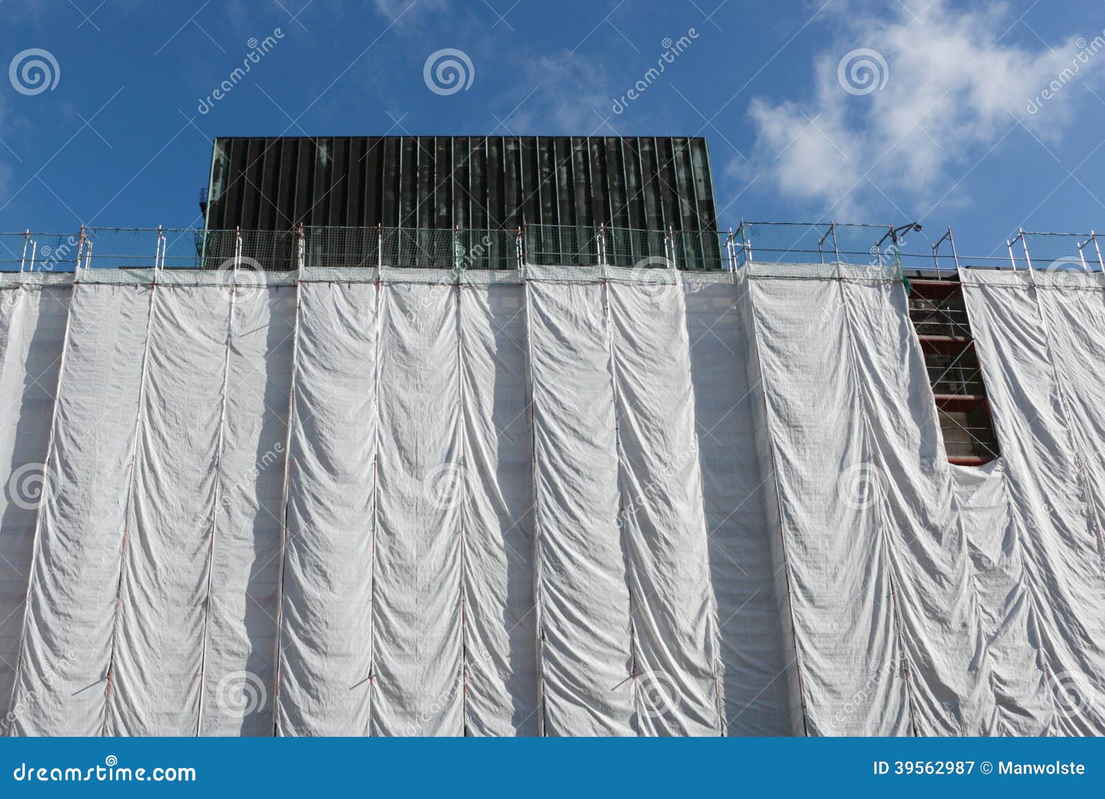 Wrapped Building at Construction Site Stock Image - Image of facade ...