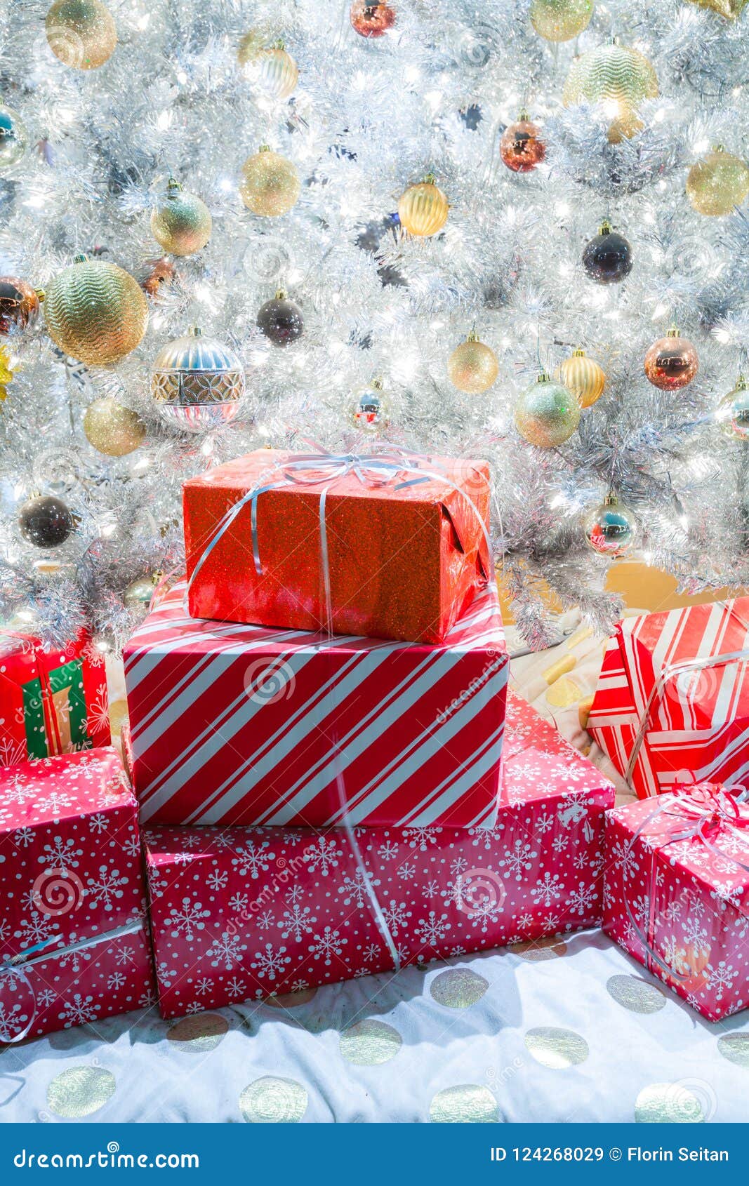 Wrapped Christmas Presents Under a White Christmas Tree Stock Image ...