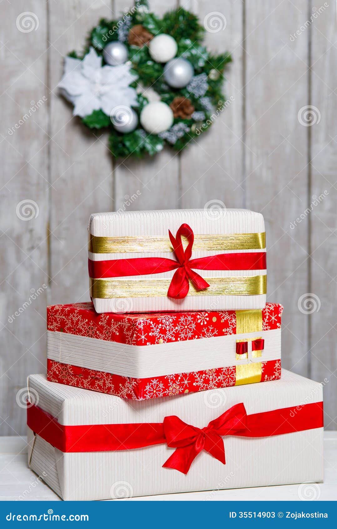Wrapped Gift Boxes and Christmas Wreath Stock Image - Image of mood ...