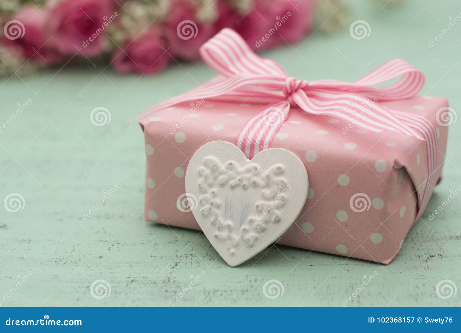 Wrapped gift and heart stock image. Image of flowers - 102368157