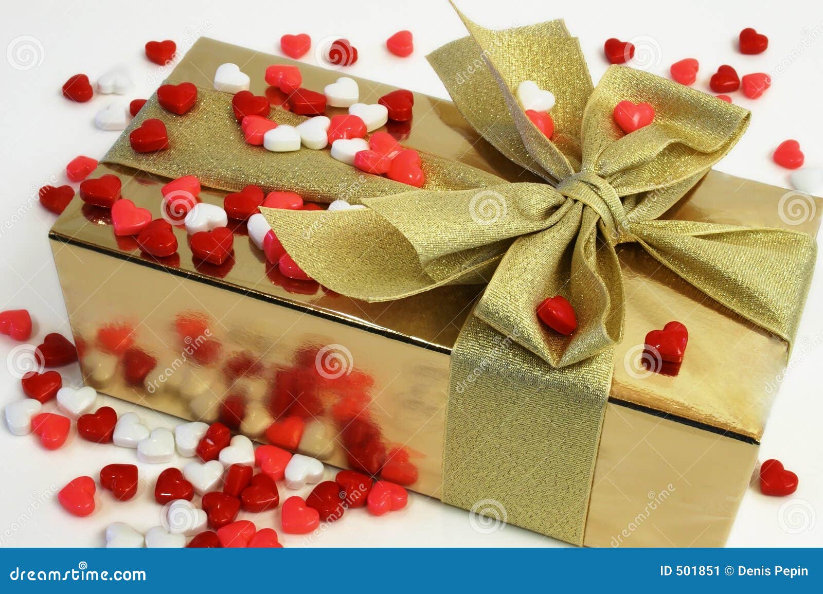 Wrapped Gift Surrounded with Heart Shaped Candies Stock Image - Image ...