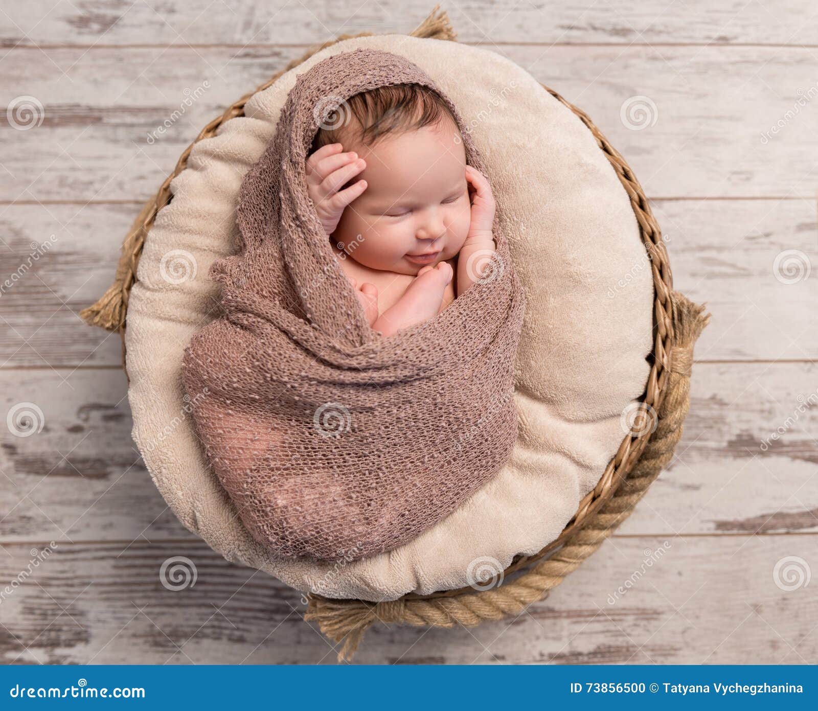 Wrapped Sleepy Baby with Folded Legs and Hands on Head Stock Photo ...
