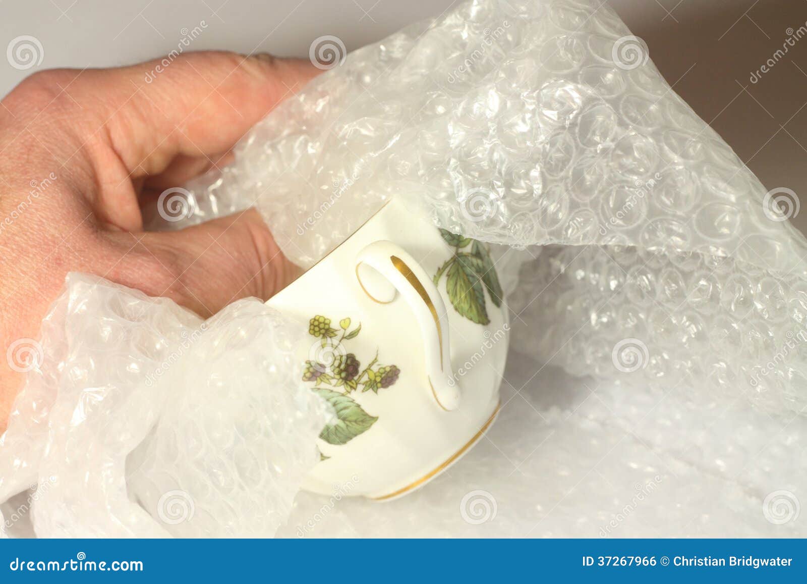 Wrapping antique cup a stock photo. Image of male, wrapping - 37267966