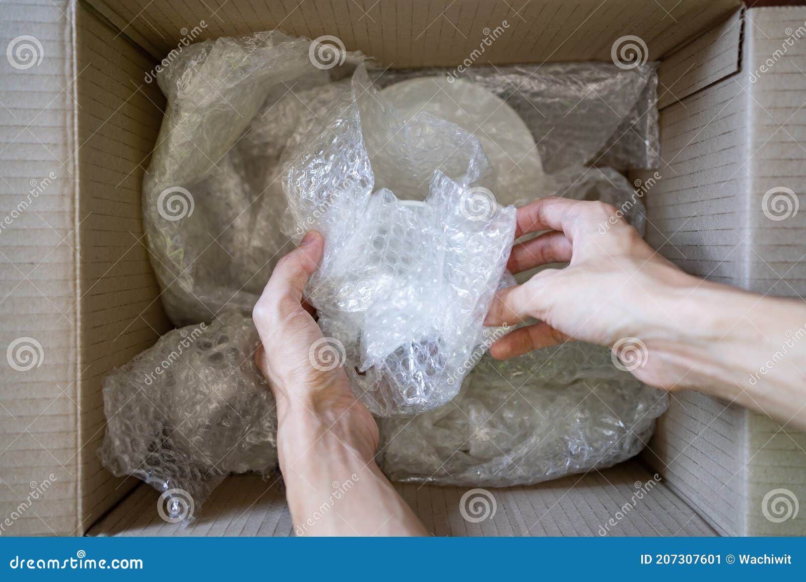 Wrapping a Ceramic Cup with Bubble Wrap Stock Image - Image of post ...