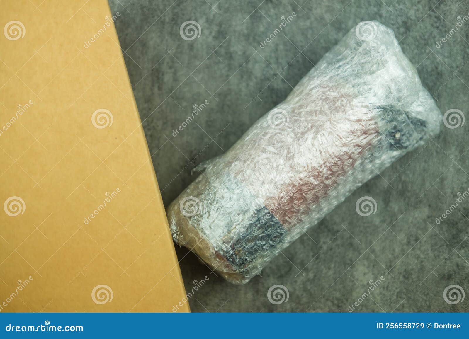 Wrapping an Item in Bubble Wrap Stock Image - Image of material ...