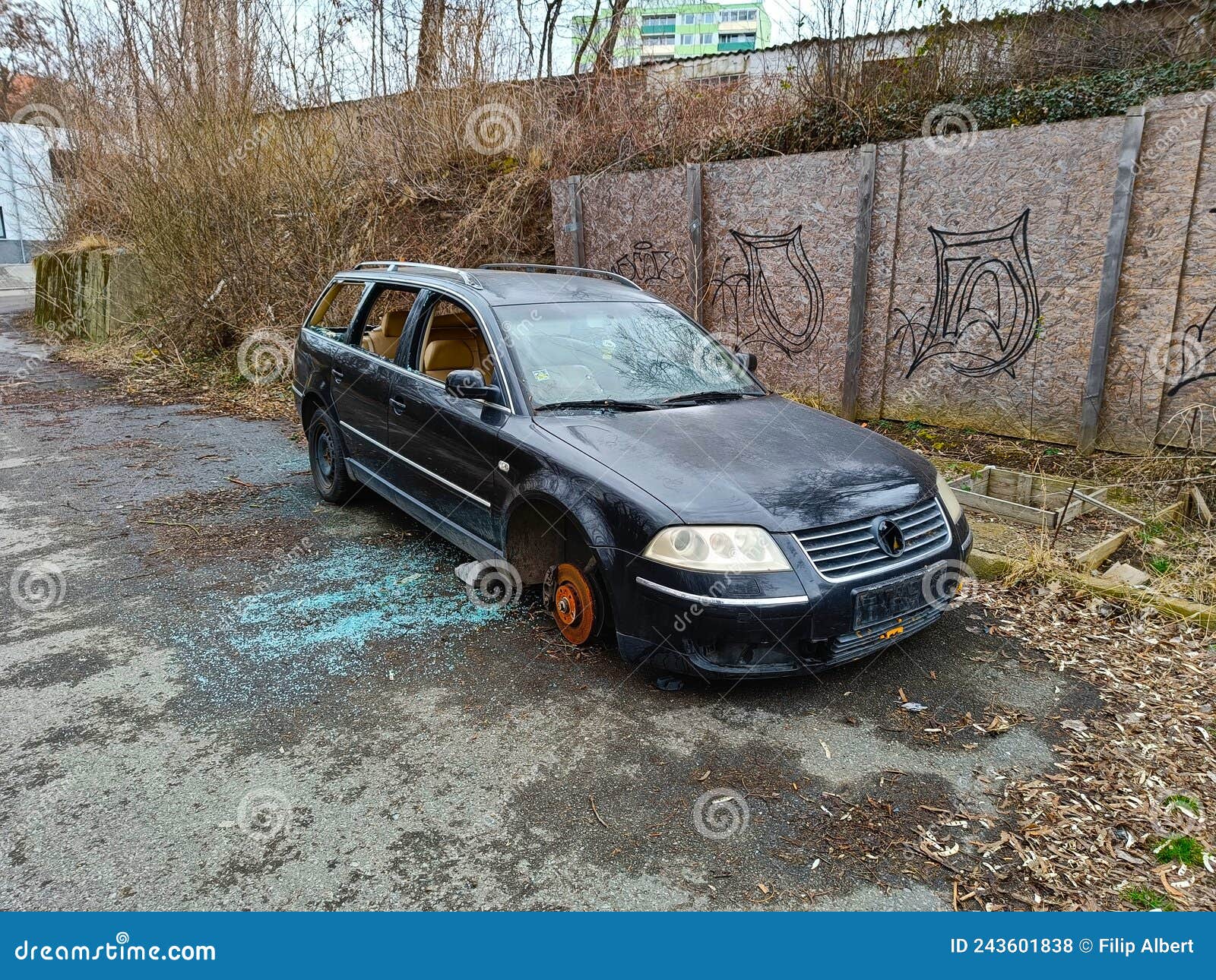 Wreck of a Car with Front Wheel Missing and Broken Windows Stock Photo ...