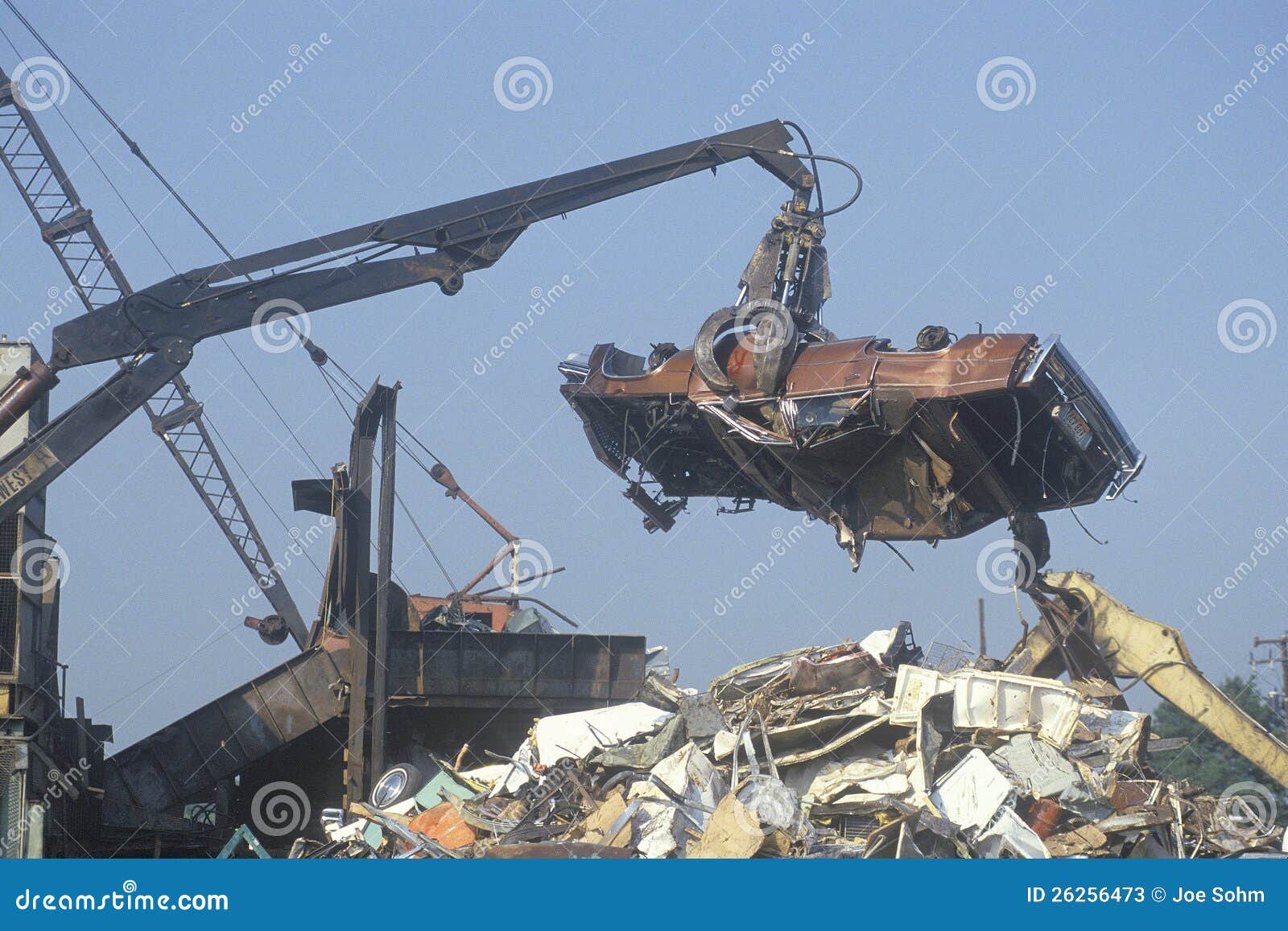 A Wrecking Crane Lowering a Demolished Automobile Editorial Stock Photo ...