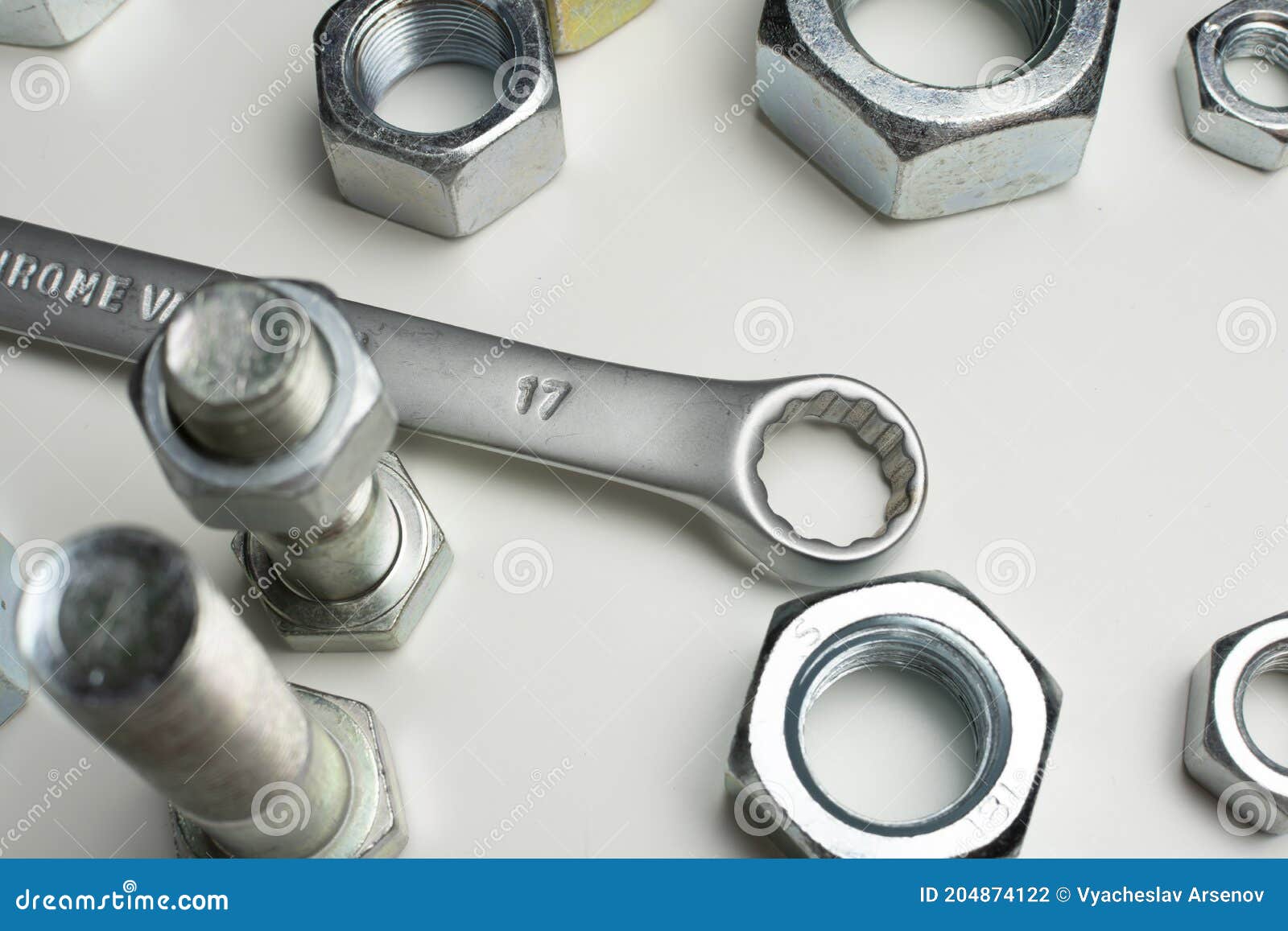 Wrench with Fasteners on a White Background Stock Photo - Image of ...