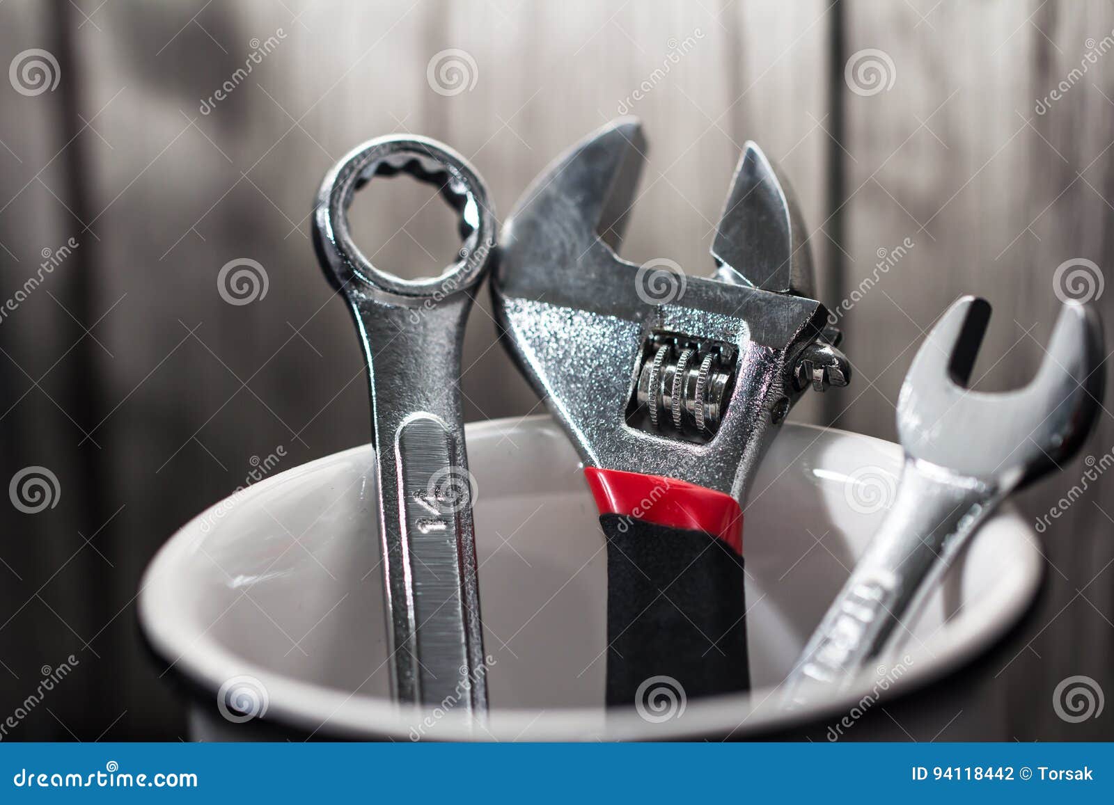 Wrench on wooden table stock photo. Image of plier, dark - 94118442