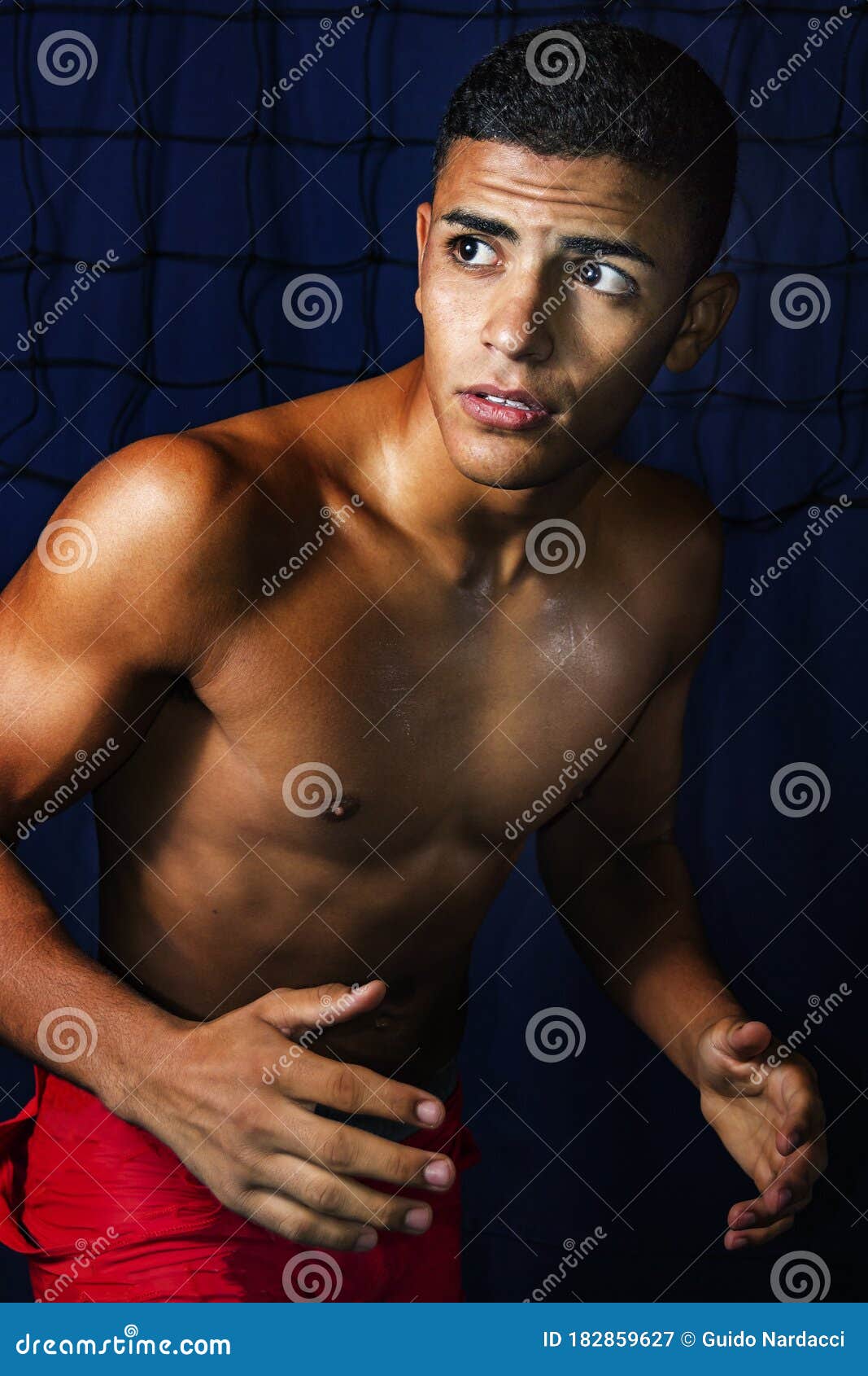 Wrestler on guard position stock image. Image of bodybuilder - 182859627