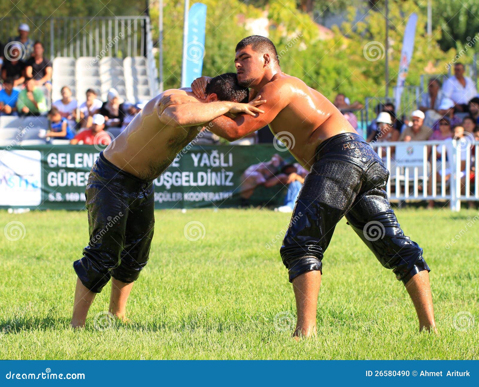 A Wrestler Has Olive Oil Applied To His Body Prior To The Start Of ...