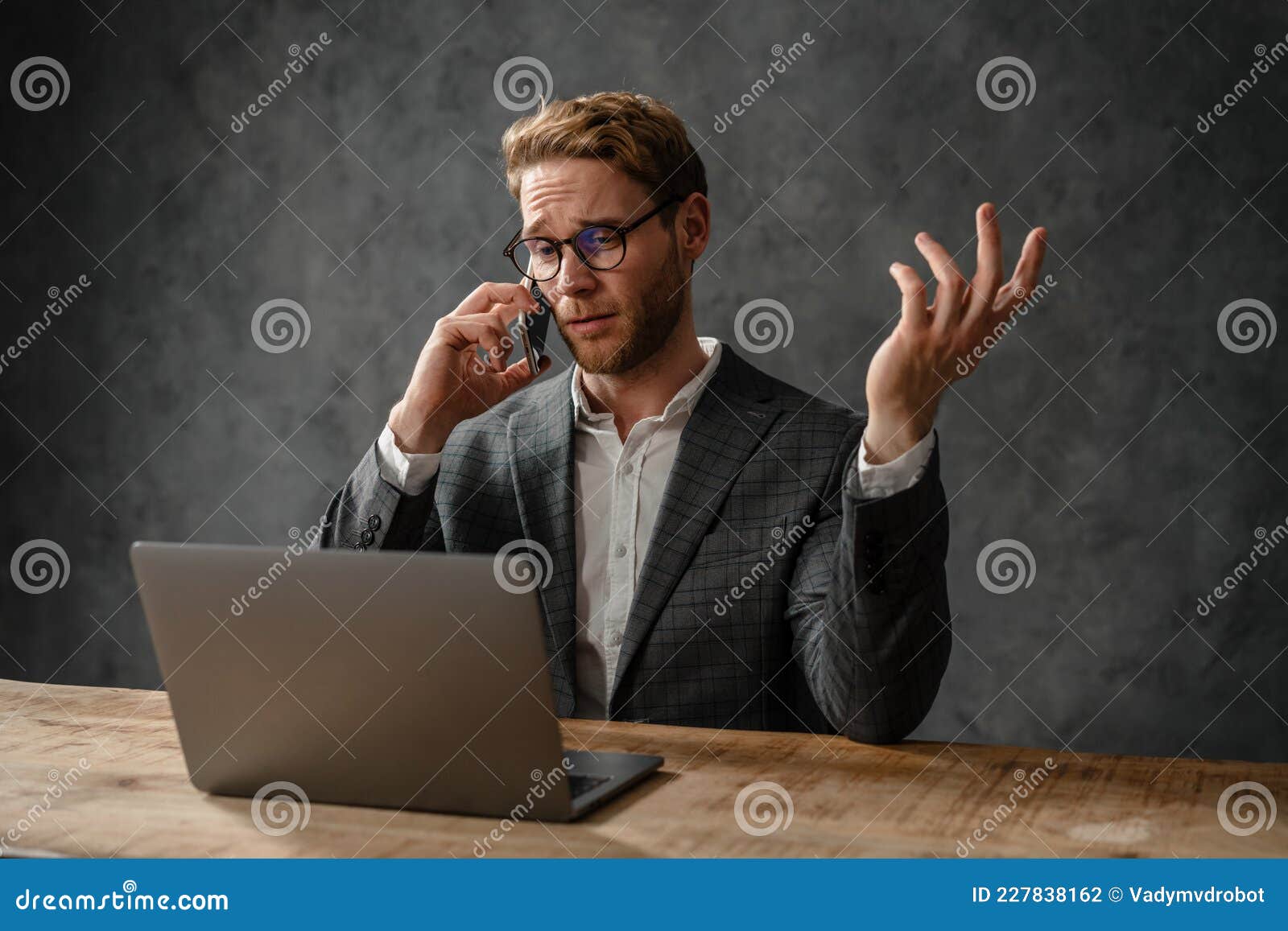 The Wrinkling Forehead Man Talking on the Phone while Looking into ...