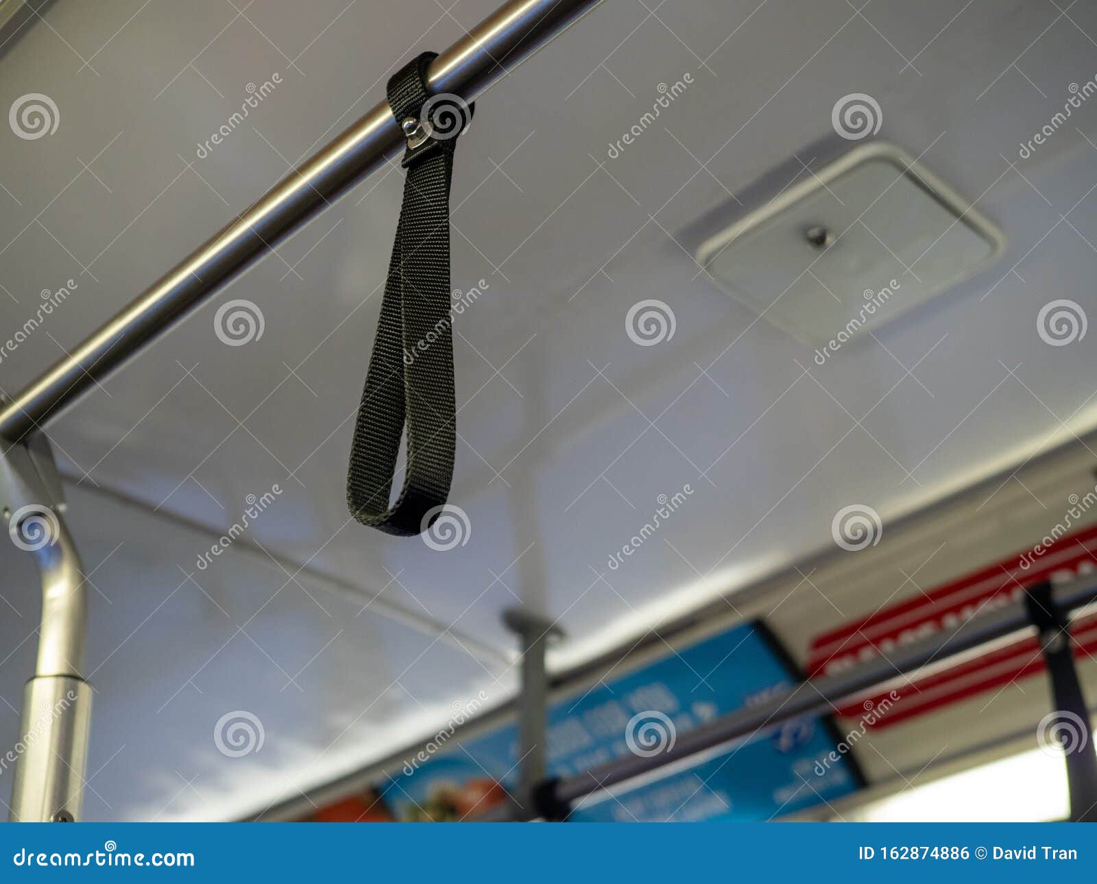 Wrist Strap Hanging on Handrail in Public Transit Bus Stock Photo ...