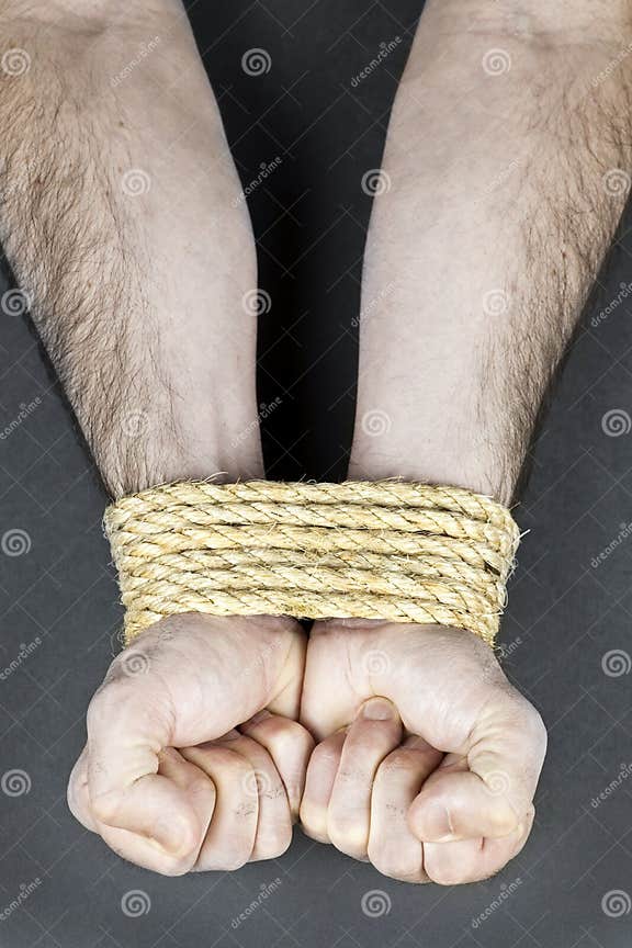 Wrists tied with rope stock photo. Image of kidnap, help - 13992904