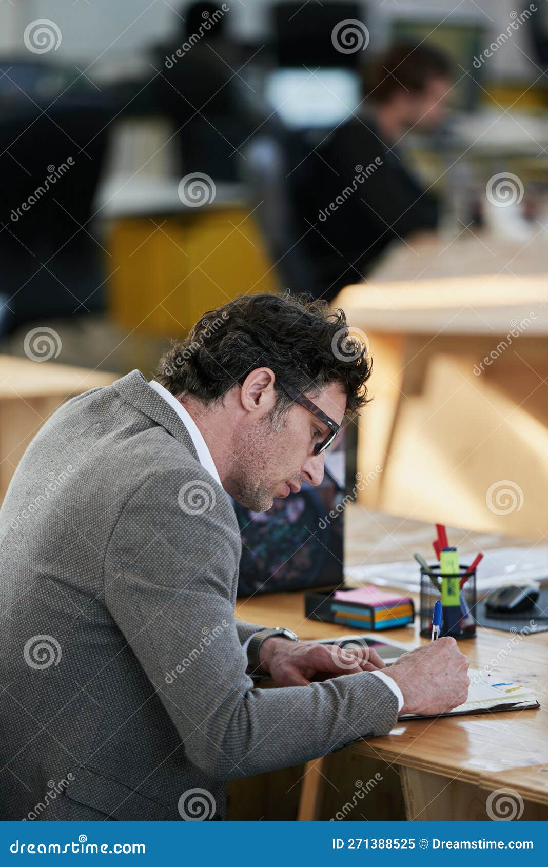 Always Write Down a Good Idea. a Man Working at His Desk in an Office ...