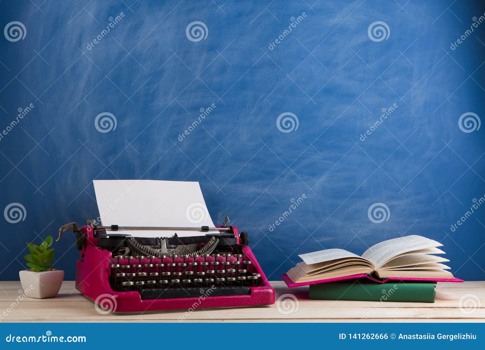 Writer S Workplace - Crimson Typewriter and Books on Blue Blackboard ...
