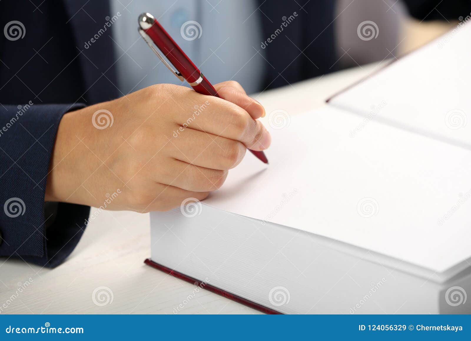 Writer Signing Autograph in Book at Table Stock Image - Image of book ...