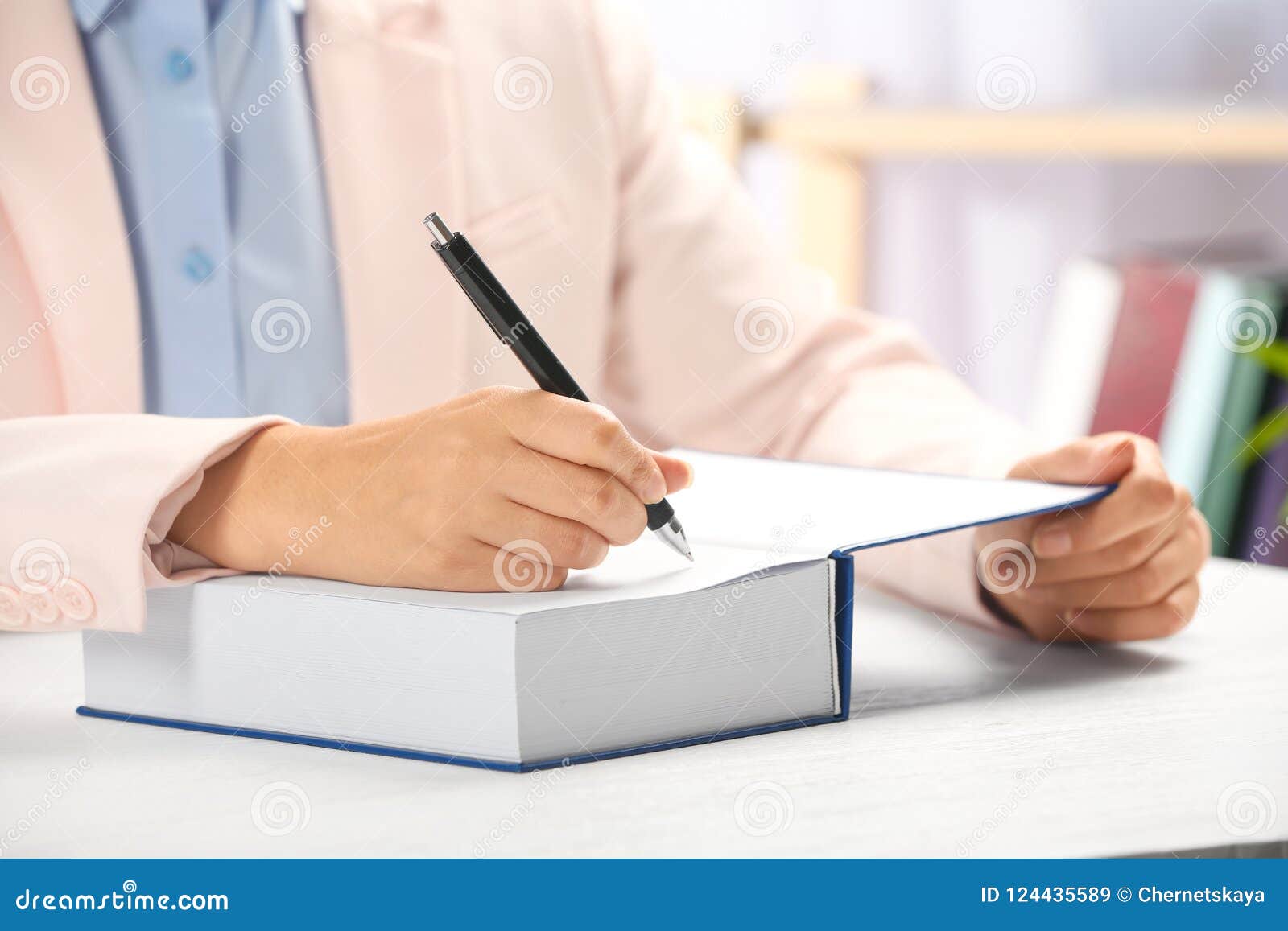 Writer Signing Autograph in Book at Table Stock Image - Image of ...