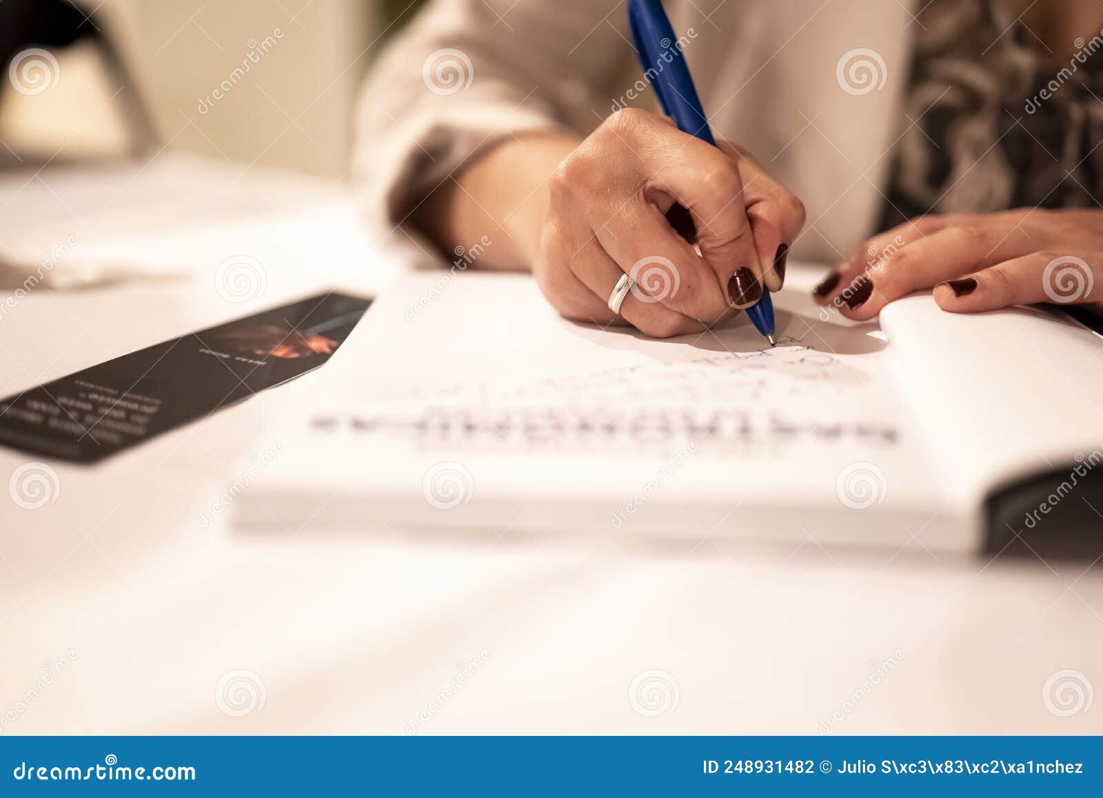 Writer signing his book stock photo. Image of white - 248931482