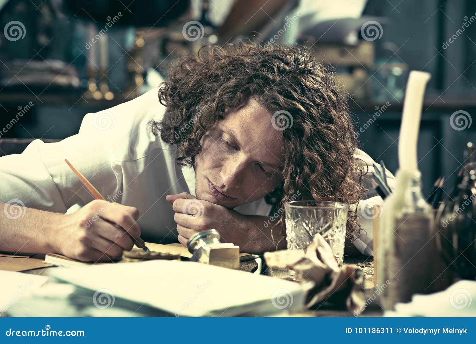 Writer at Work. Handsome Young Writer Sitting at the Table and Writing ...