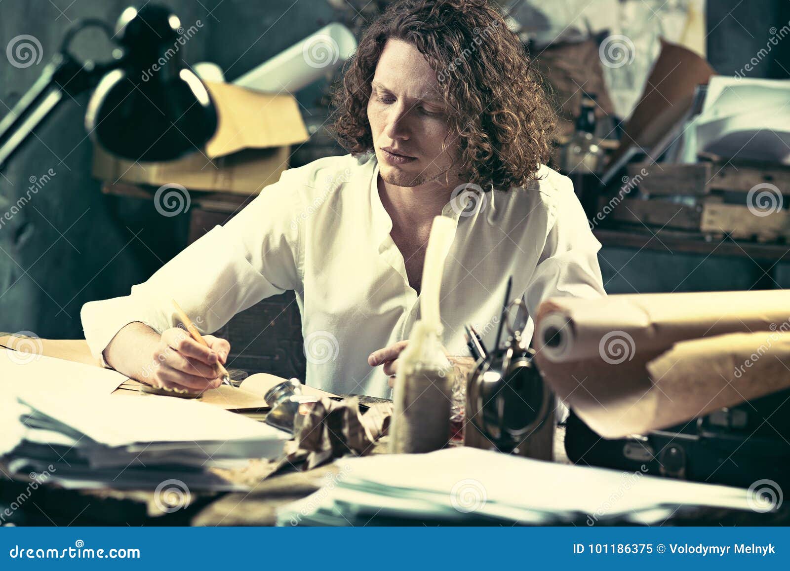Writer at Work. Handsome Young Writer Sitting at the Table and Writing ...