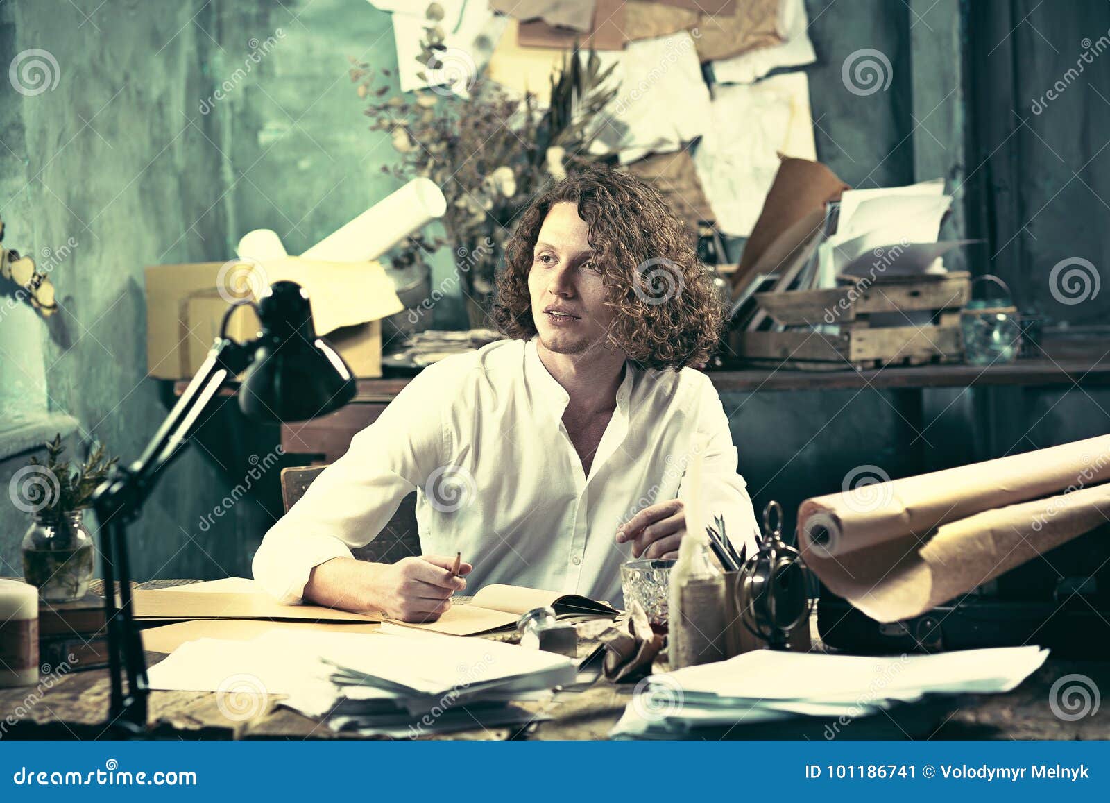 Writer at Work. Handsome Young Writer Sitting at the Table and Writing ...