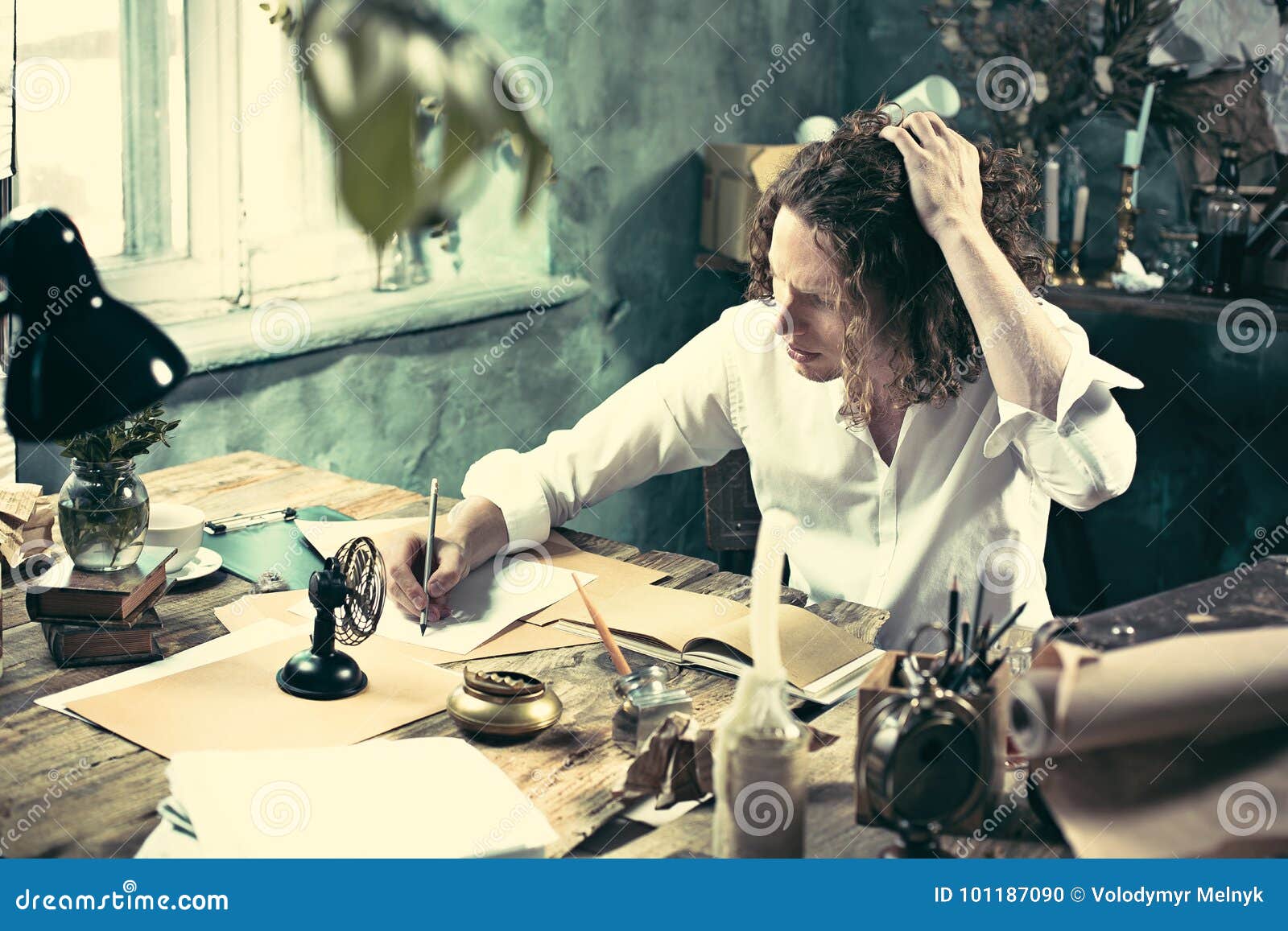 Writer at Work. Handsome Young Writer Sitting at the Table and Writing ...