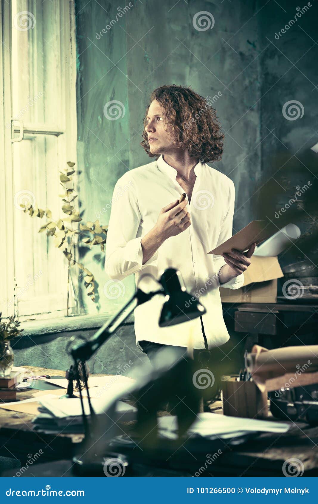 Writer at Work. Handsome Young Writer Standing Near the Table and ...