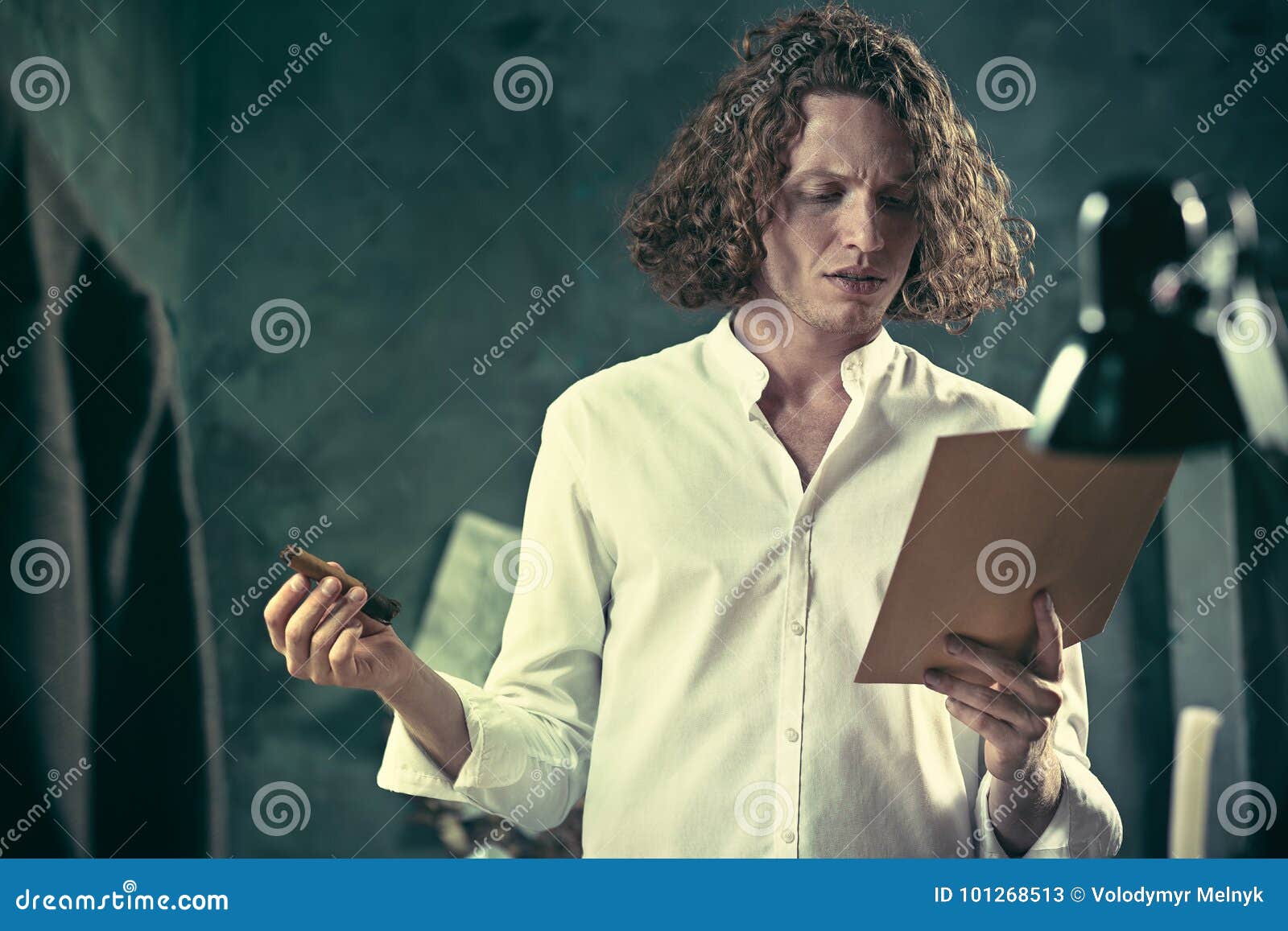 Writer at Work. Handsome Young Writer Standing Near the Table and ...